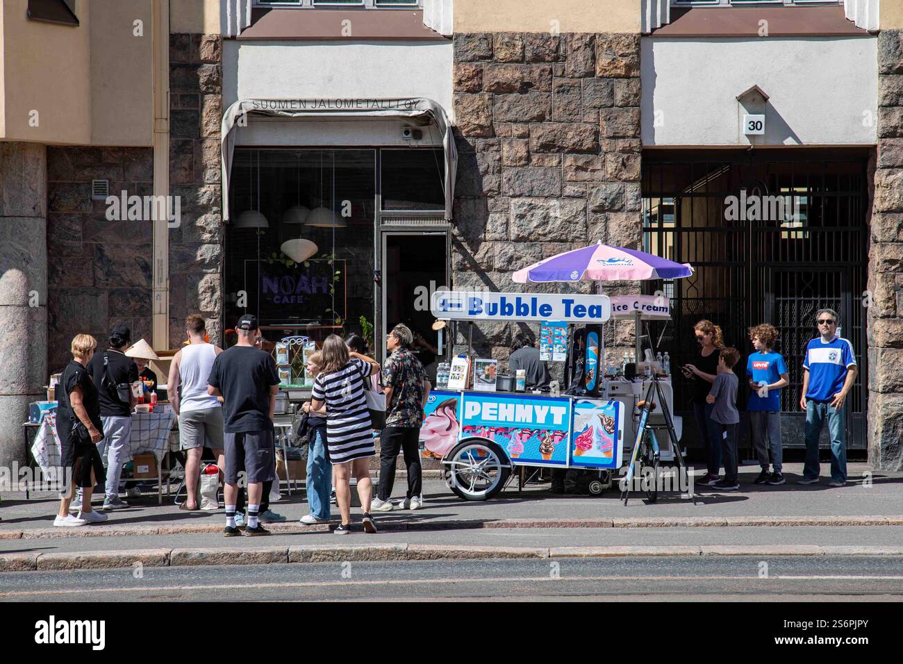 Street vendor's bubble tea and ice cream cart in front of Hämeentie 30 ...