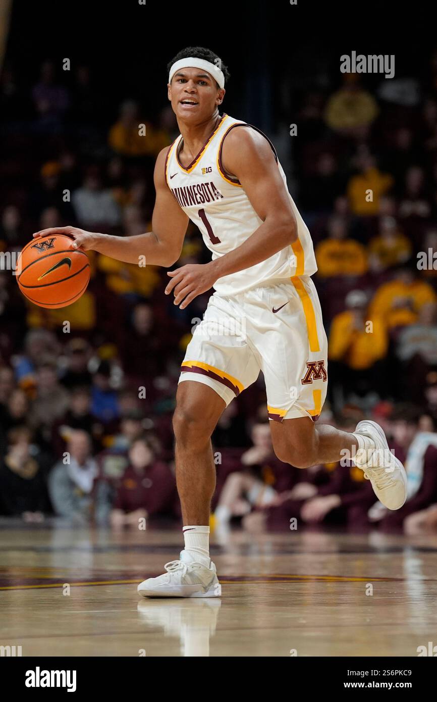 Minnesota guard Isaac Asuma (1) dribbles down the court during the ...