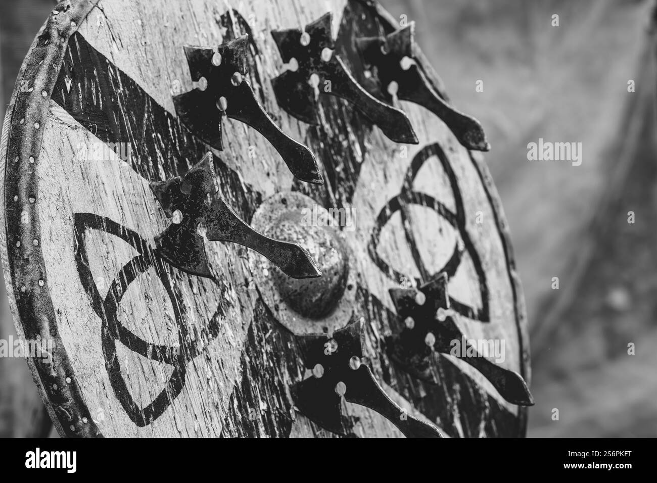 A black and white image of a Viking shield with a Celtic cross on it ...