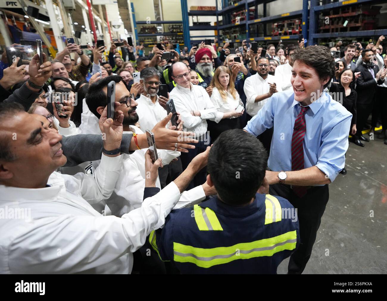 Prime Minister Justin Trudeau, right, meets employees at the Martinrea ...