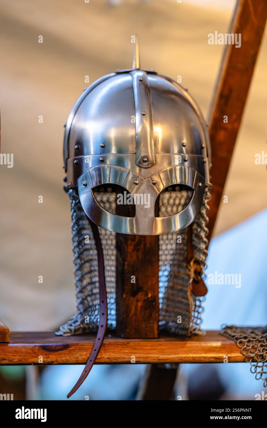 A helmet with a pointed spike on top of it. The helmet is made of metal ...