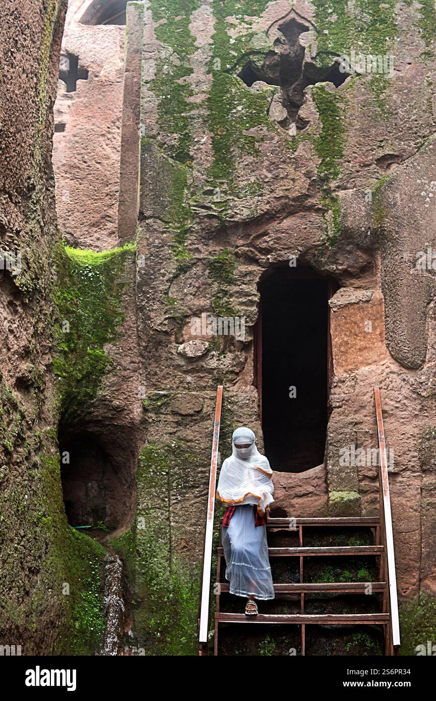 Believers leaving the symbolic tomb of Adam after prayer, Lalibela ...