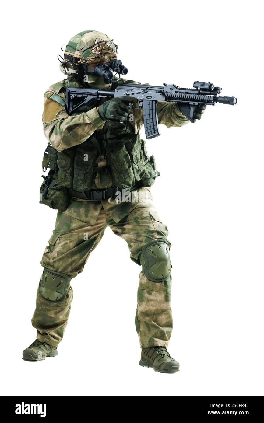 A military soldier is equipped with full tactical gear, camouflaged ...