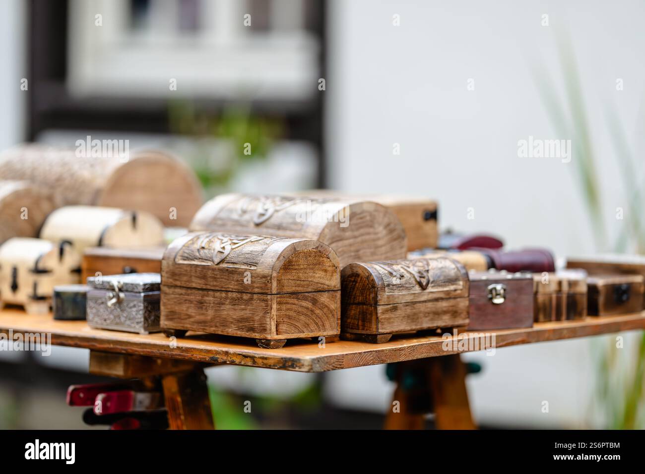 A table with wooden boxes on it. The boxes are of different sizes and ...