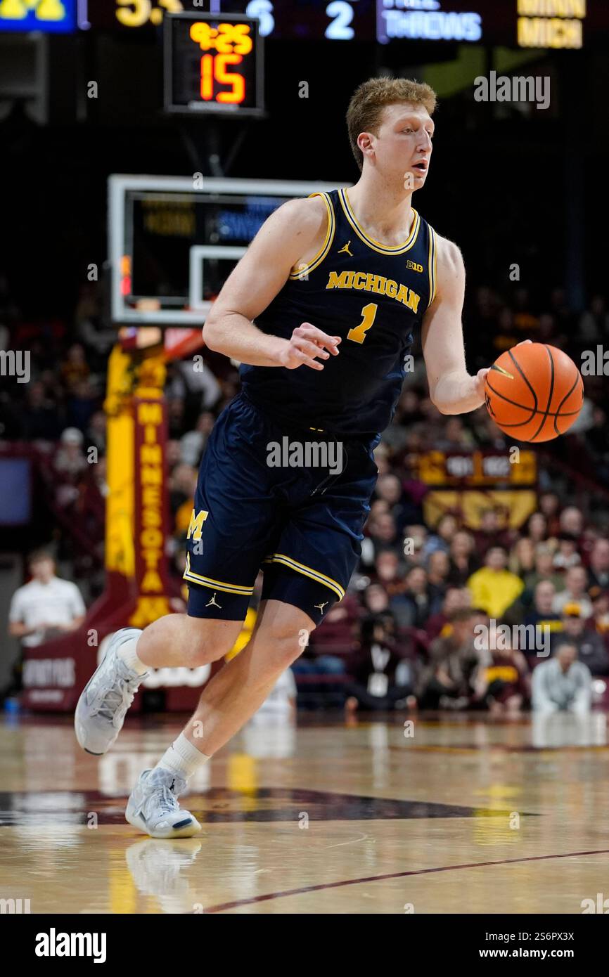 Michigan center Danny Wolf (1) dribbles down the court during the ...