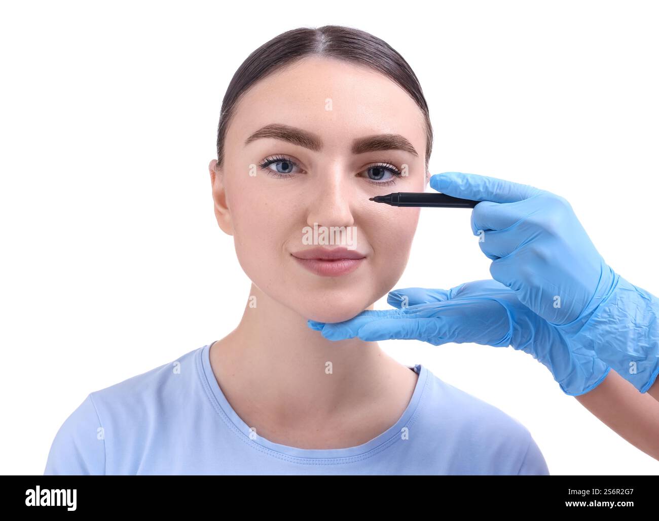 Doctor drawing marks on patient's nose for plastic surgery operation ...