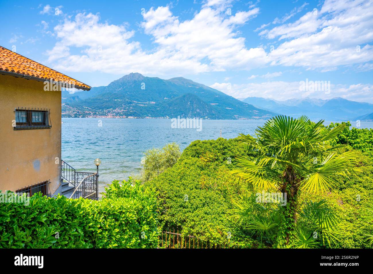 A beautiful landscape showcases the serene waters of Lake Como, framed ...