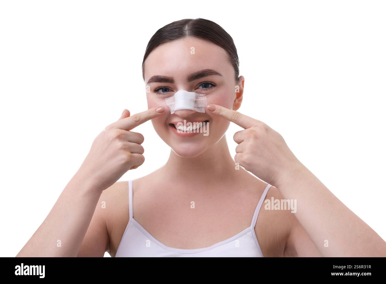 Woman with medical bandage on her nose after plastic surgery operation ...