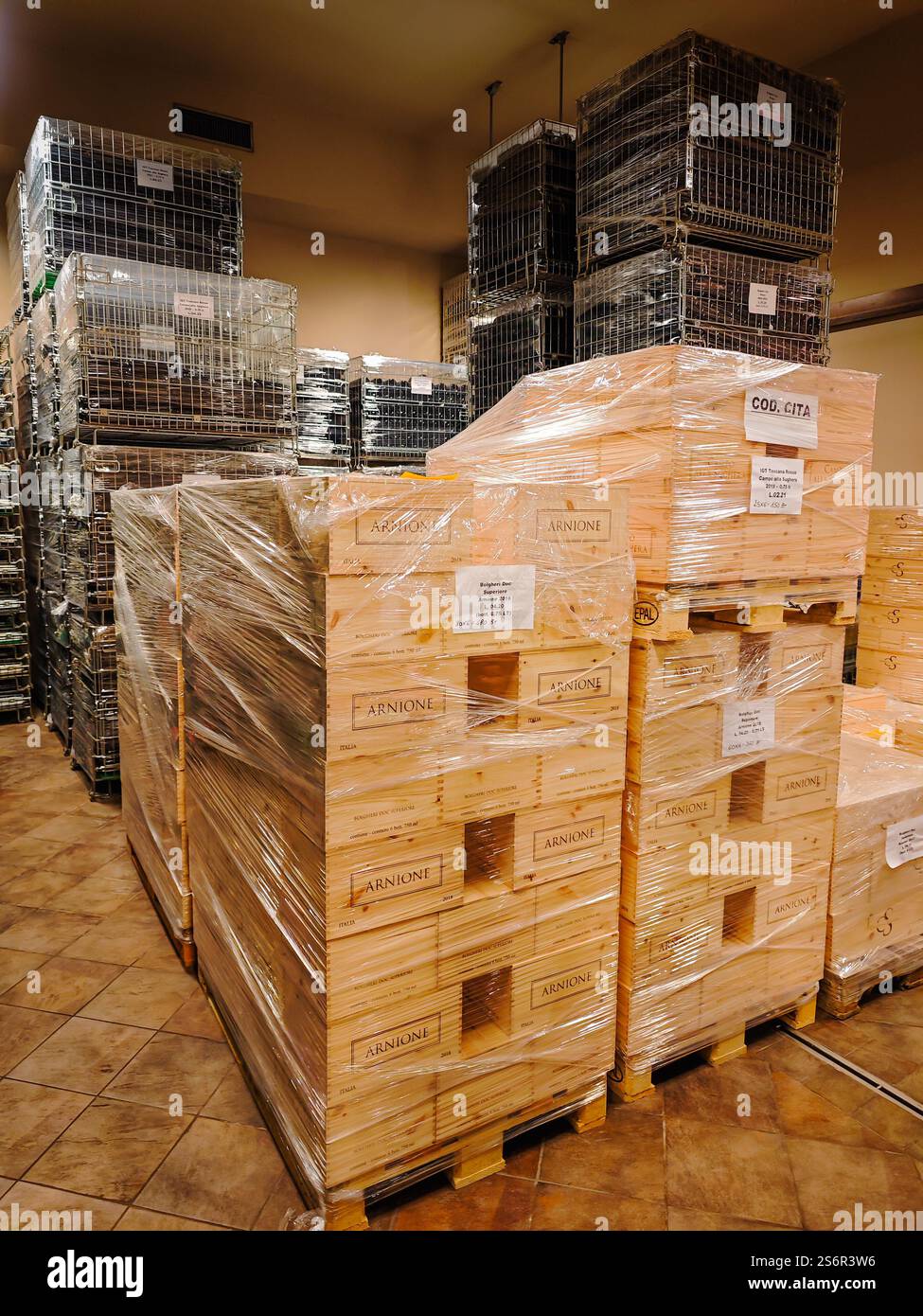 Tuscany, Italy - 01 17 2025. Inside a winery. Wine packed into boxes in ...