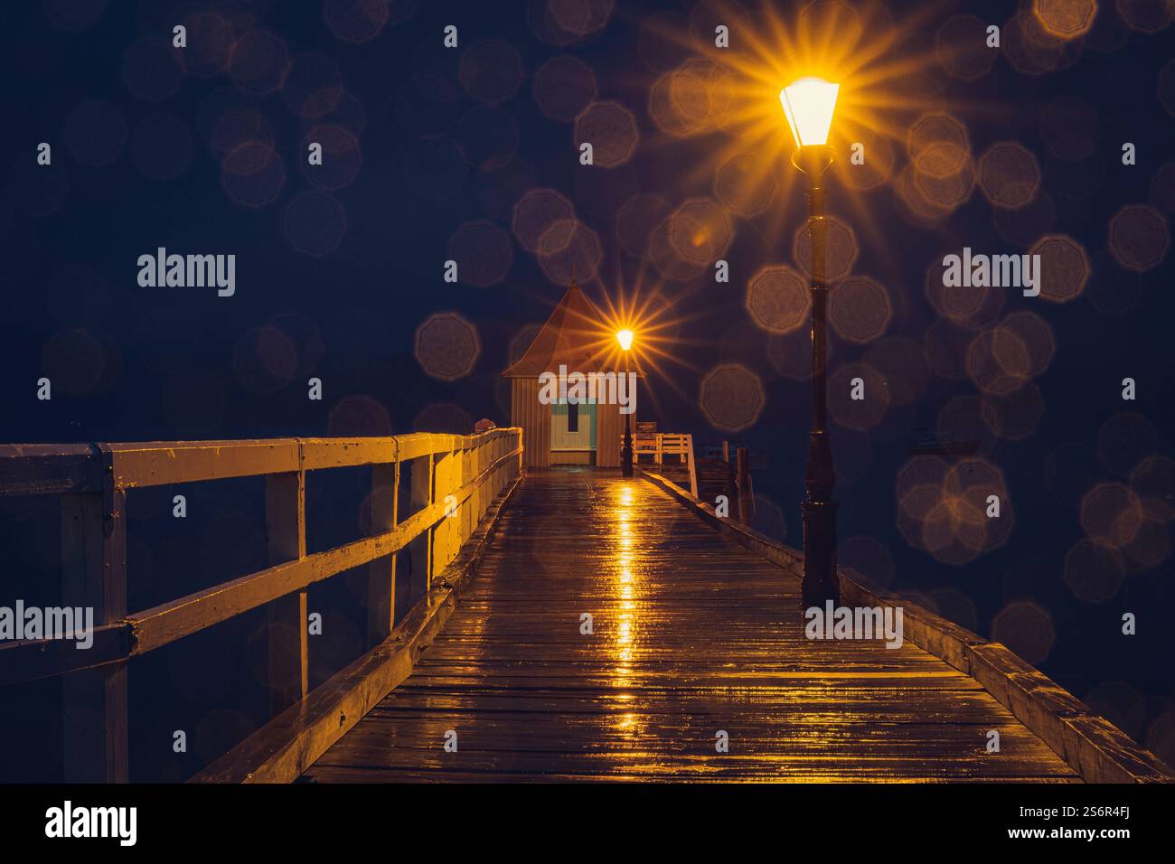 The historic wooden jetty at Daly's Wharf in Akaroa on New Zealand's ...