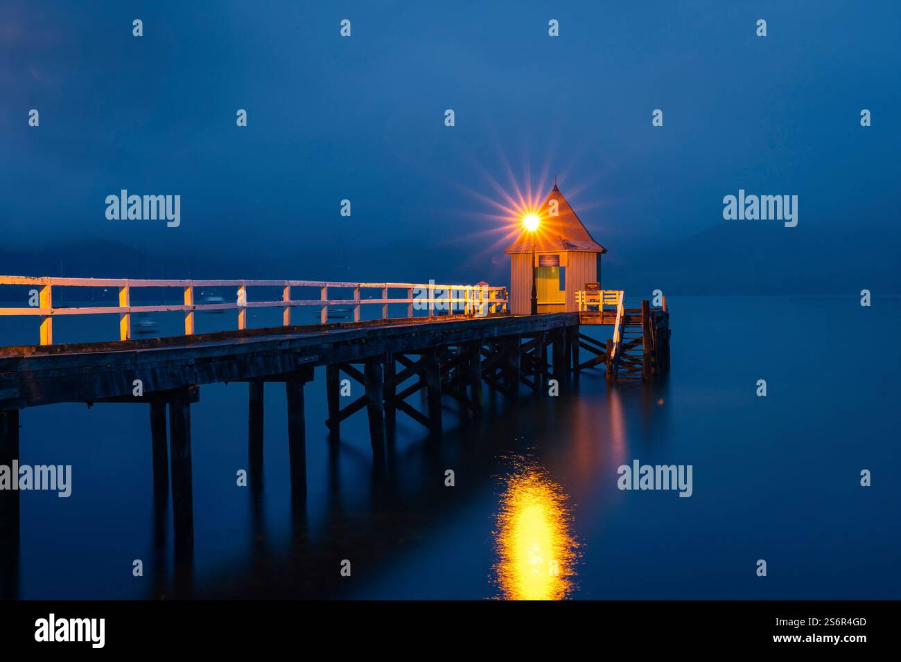 The historic wooden jetty at Daly's Wharf in Akaroa on New Zealand's ...