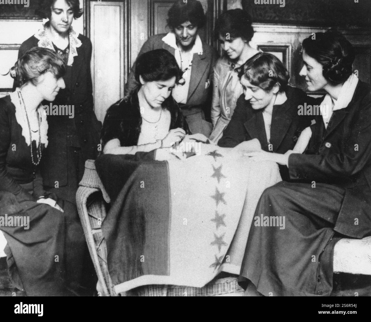 FILE - Alice Paul, seated second from left, sews the 36th star on a ...