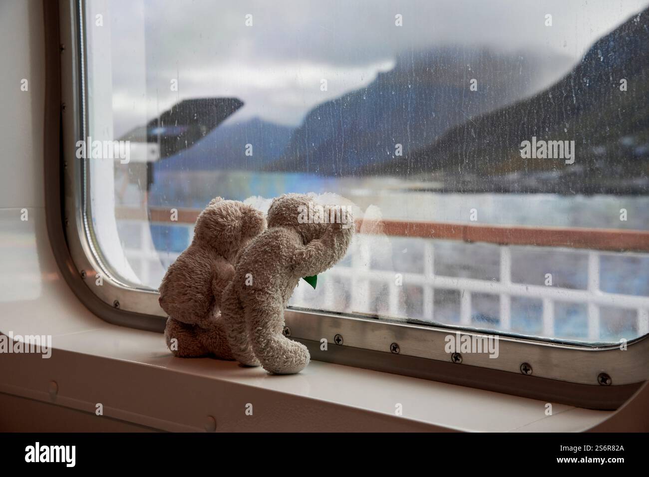 Boat trip with children, cuddly toys look out of the cabin window ...