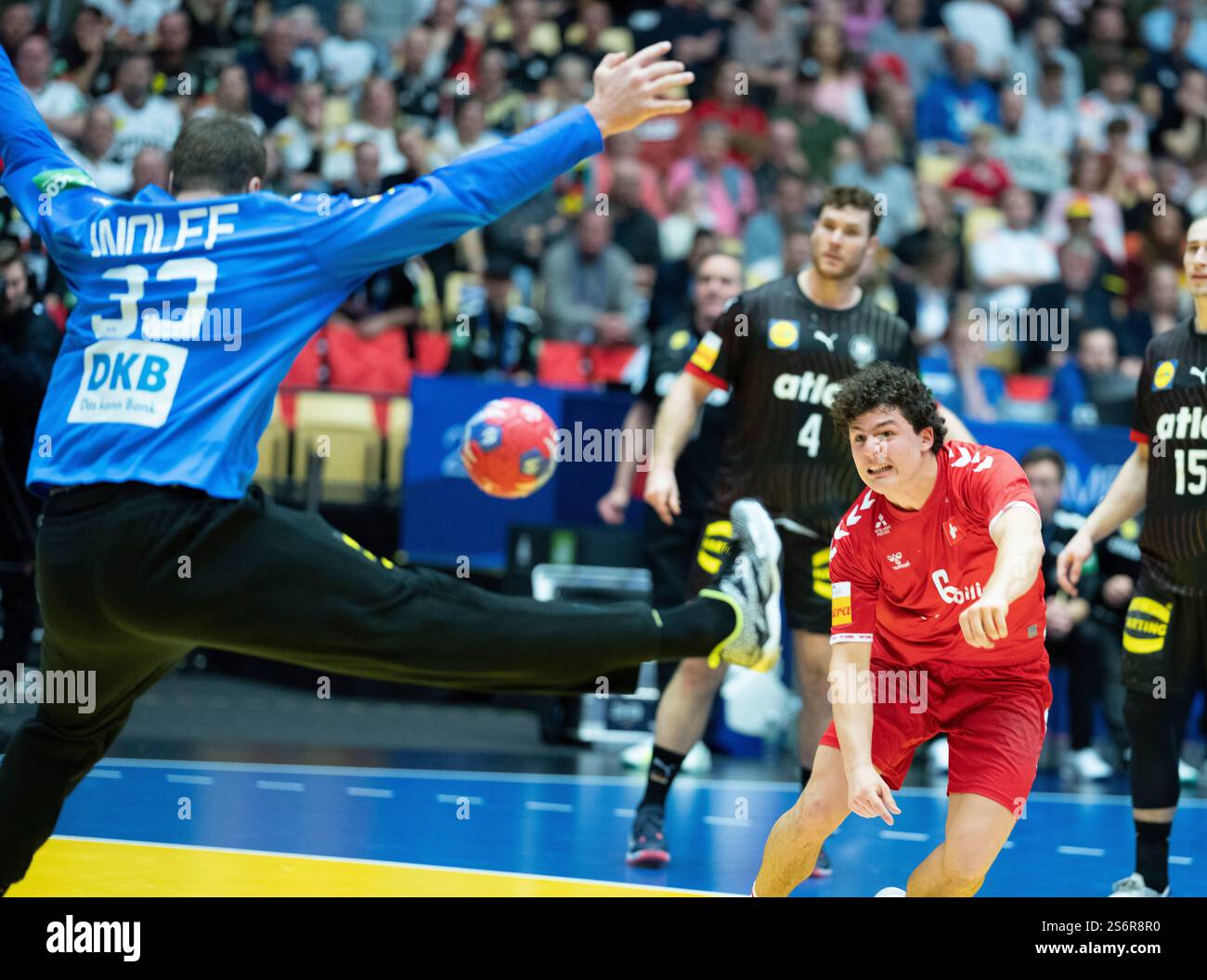 German goalkeeper Andreas Wolff makes a save on Switzerland's Gian ...