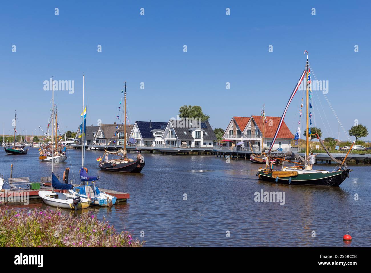 Wattensail, traditional ships on the Harle, background, pile dwelling ...
