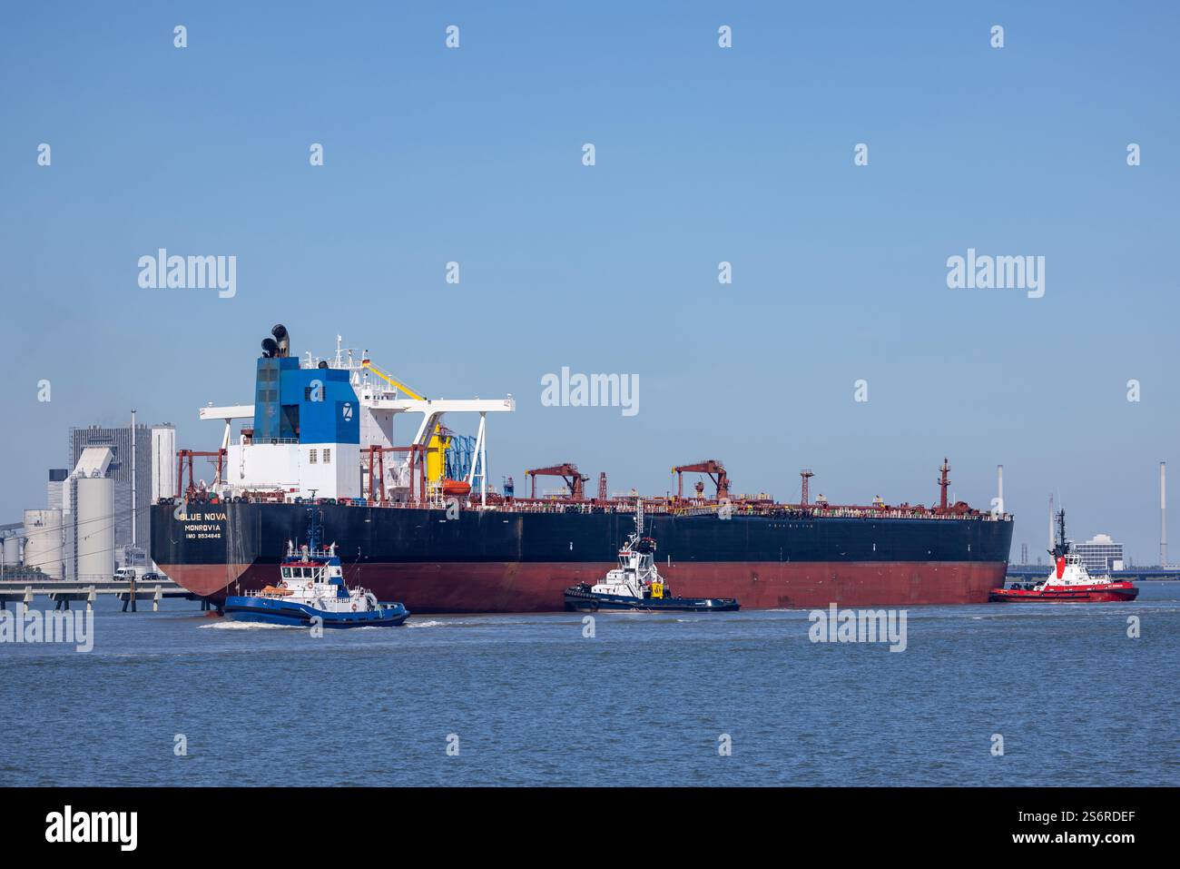 Crude oil tanker Blue Nova is supported by tugs during mooring at the ...