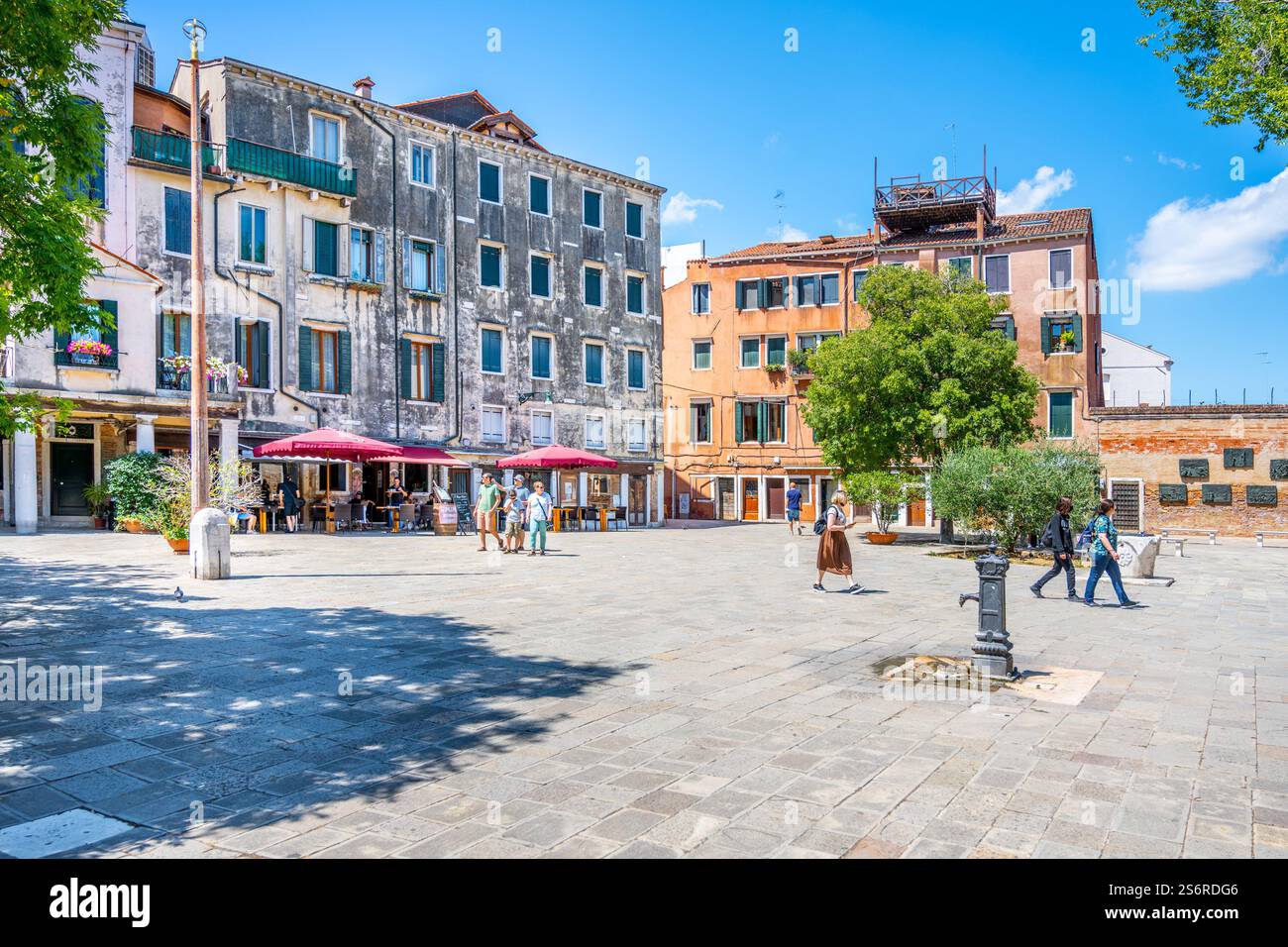 Visitors stroll through the historic Venetian Ghetto, surrounded by ...