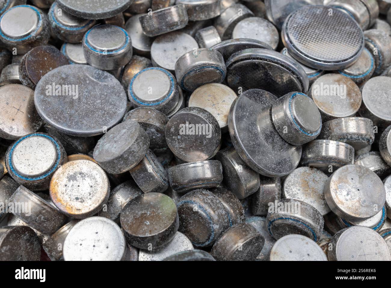 Many used button cells, various sizes and brands, crystalline residues ...
