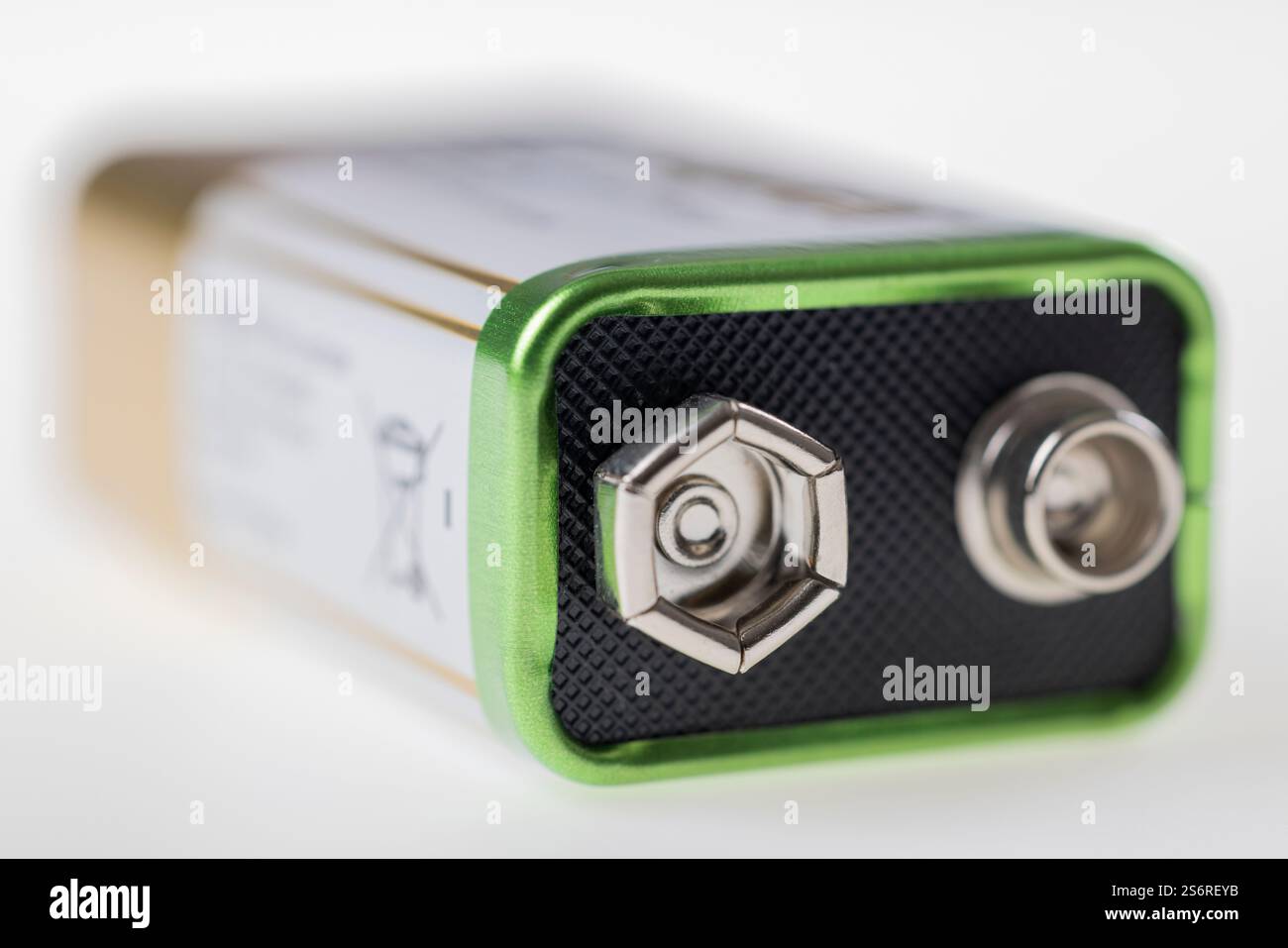 New GP 9 volt block battery, plus and minus pole, blurred, white ...