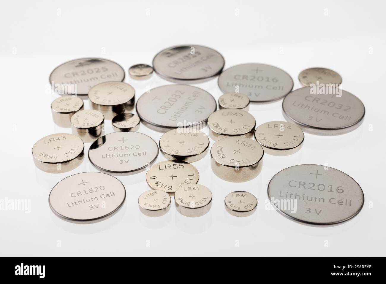 New button cells, various sizes, white background Stock Photo - Alamy