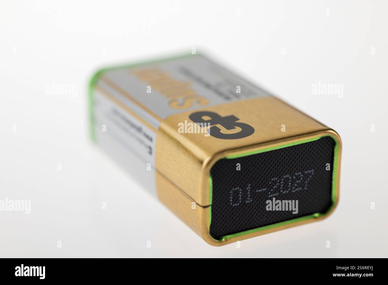 New GP 9 volt block battery, bottom side with expiration date, blurred ...