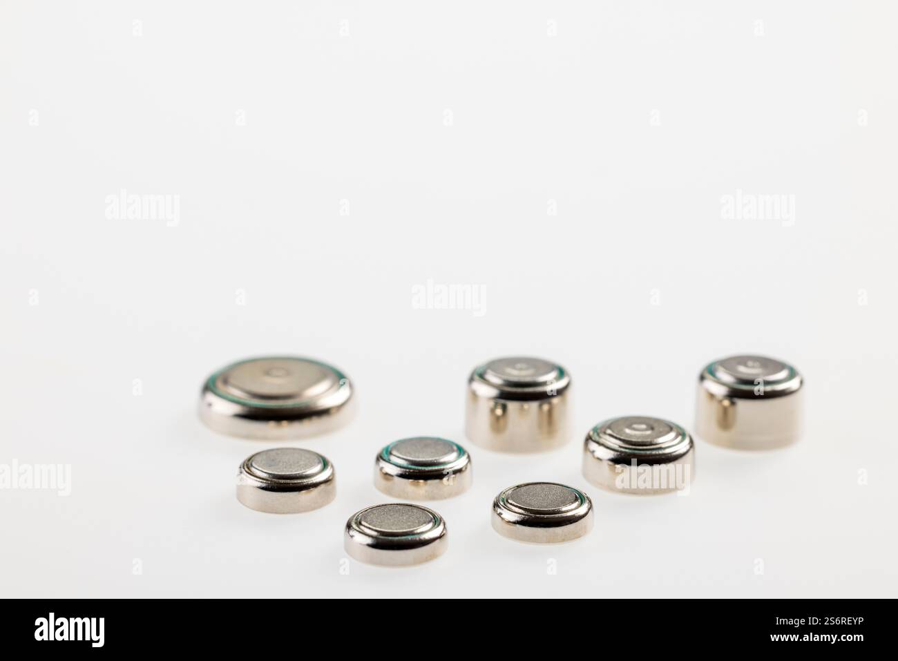 Watch batteries, various sizes, white background, symbol photo, battery ...