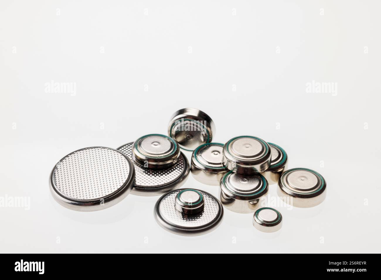 New button cells, various sizes, white background Stock Photo - Alamy