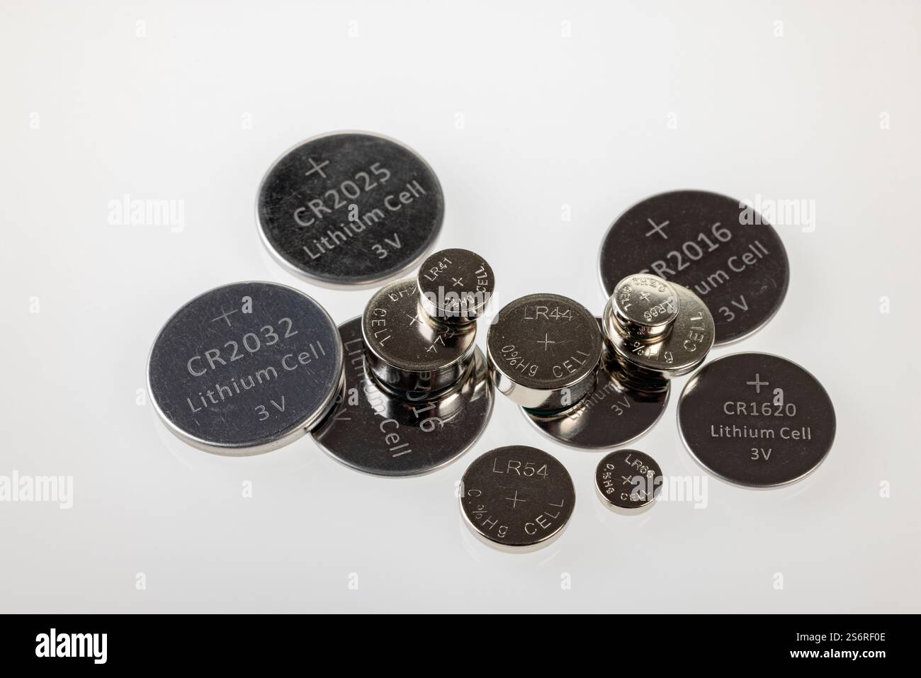 New button cells, various sizes, white background Stock Photo - Alamy