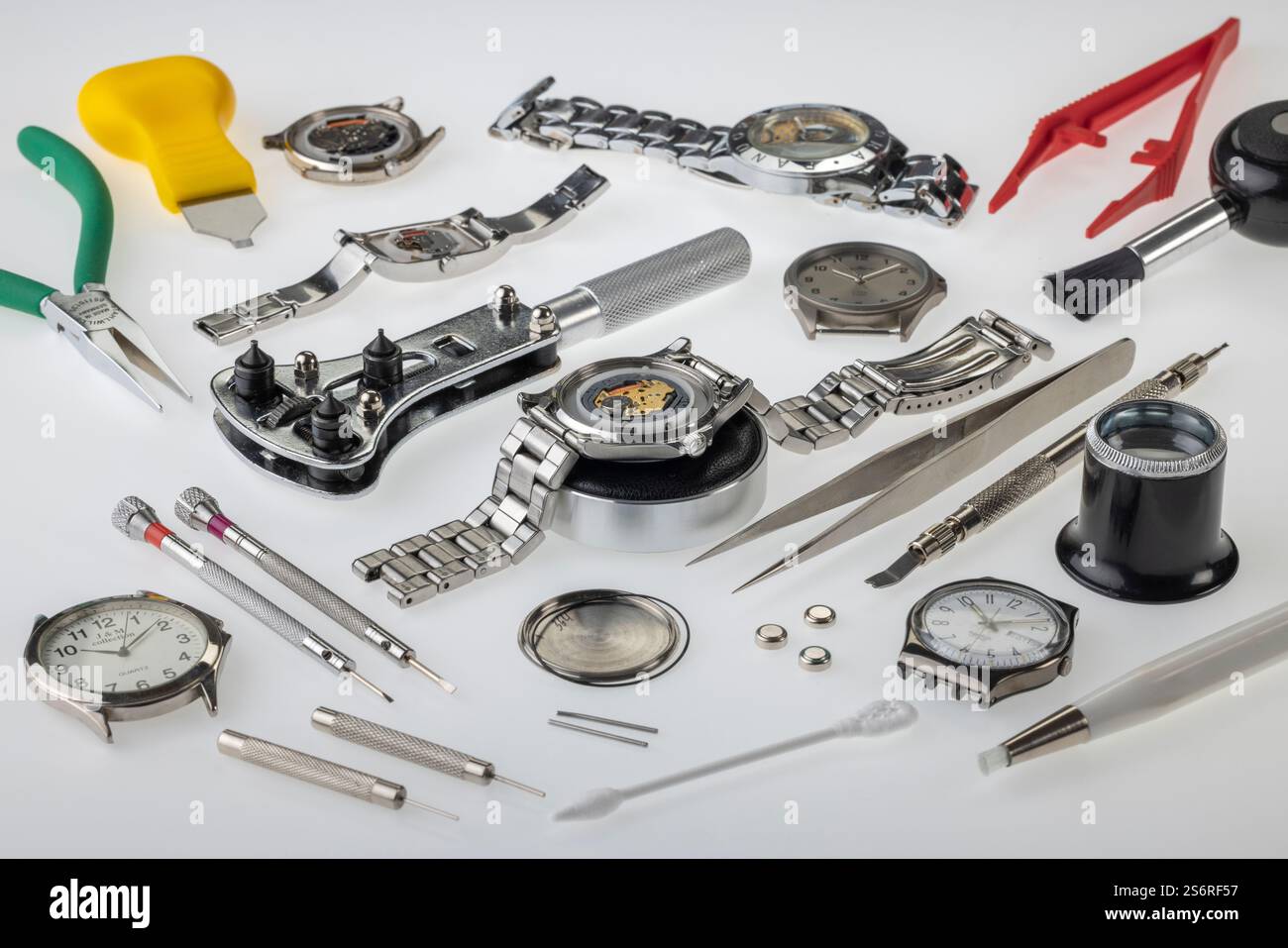 Watch case open, lying on watch case cushion, watches, watch battery ...