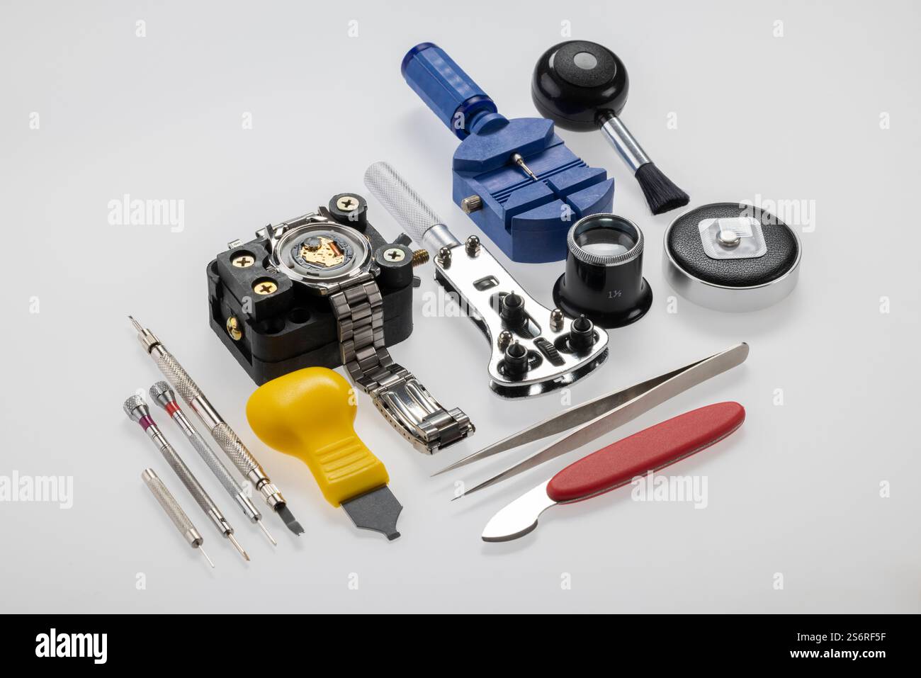 Watch case holder with watch case open, watchmaker's tool, white background, symbol photo ...