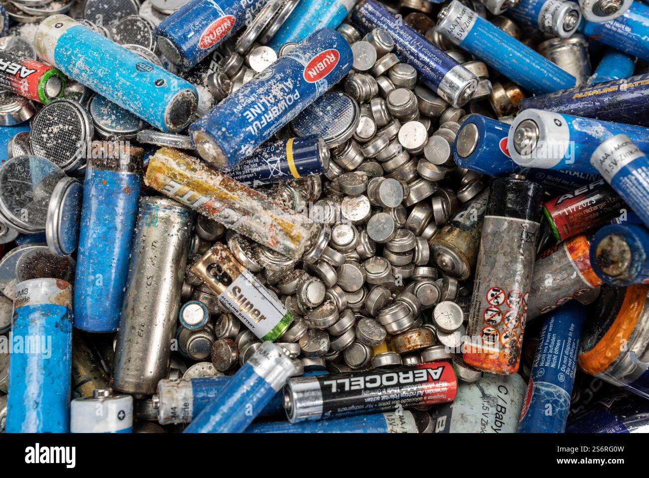 Used batteries in plastic container, detail, different sizes and brands ...