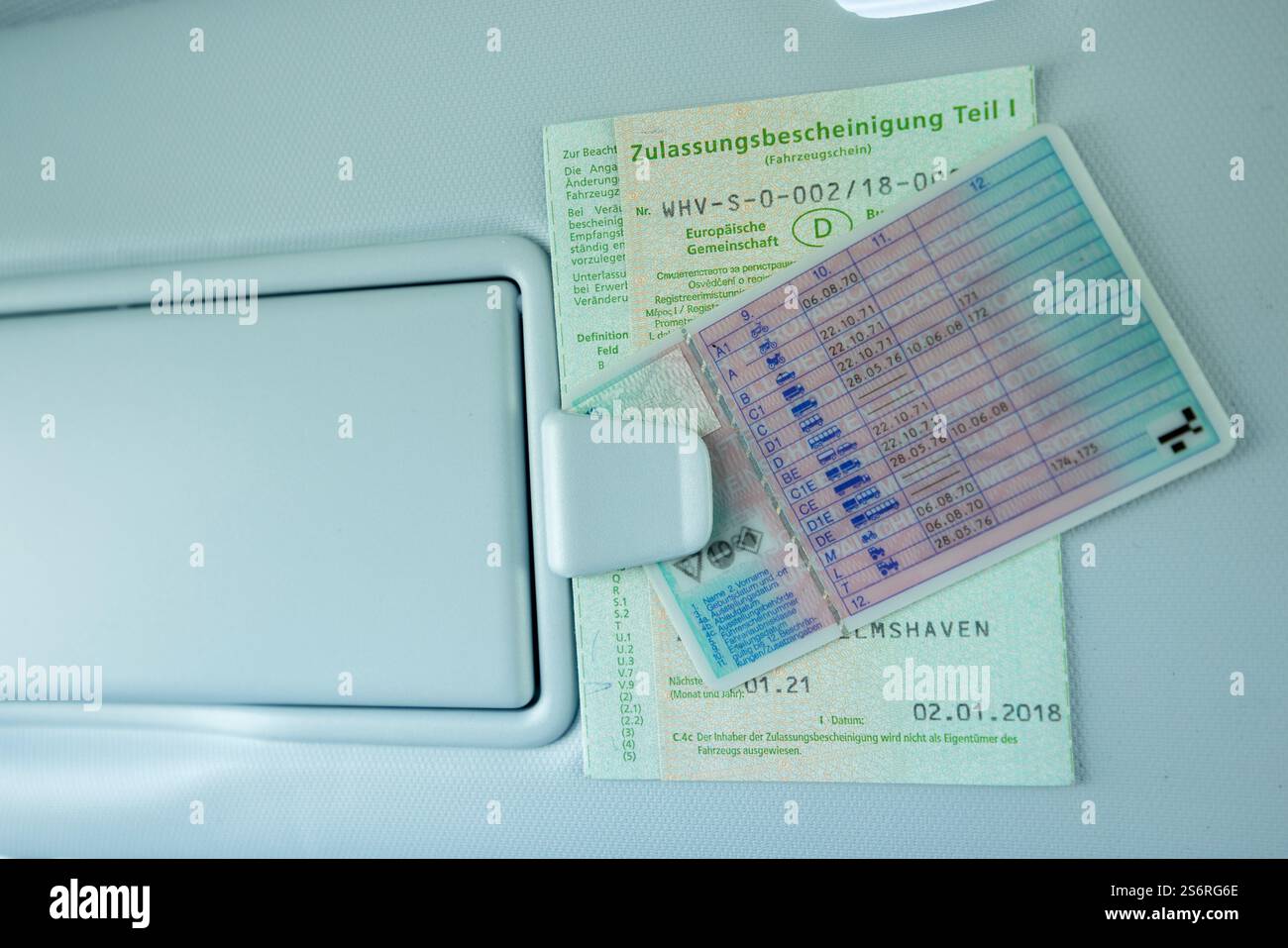 Car sun visor, documents behind the driver's sun visor, registration ...