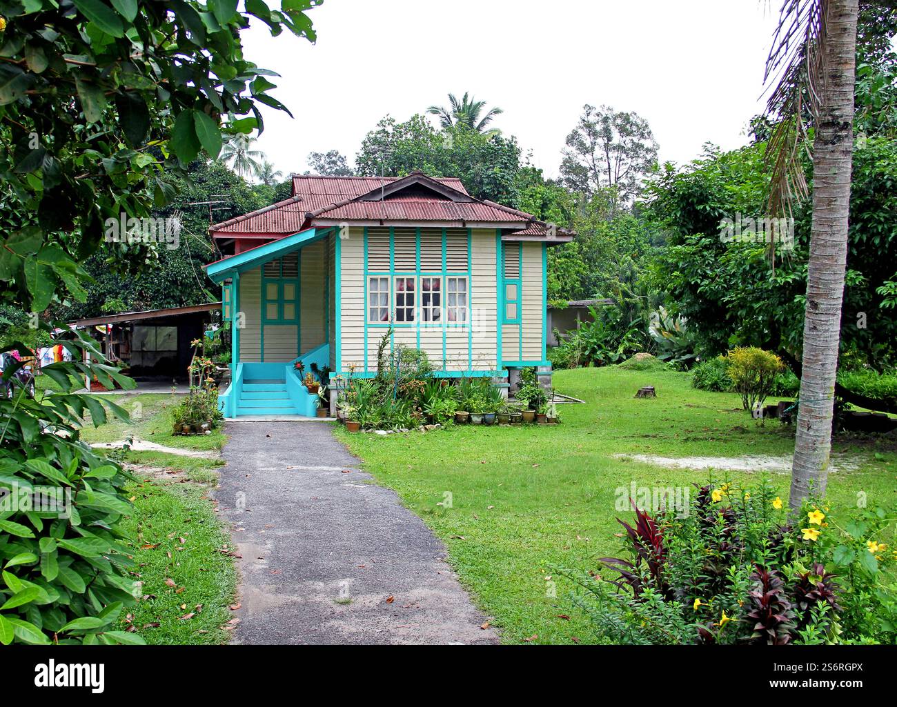 A typical traditional Malay wooden house on stilts in the village of ...