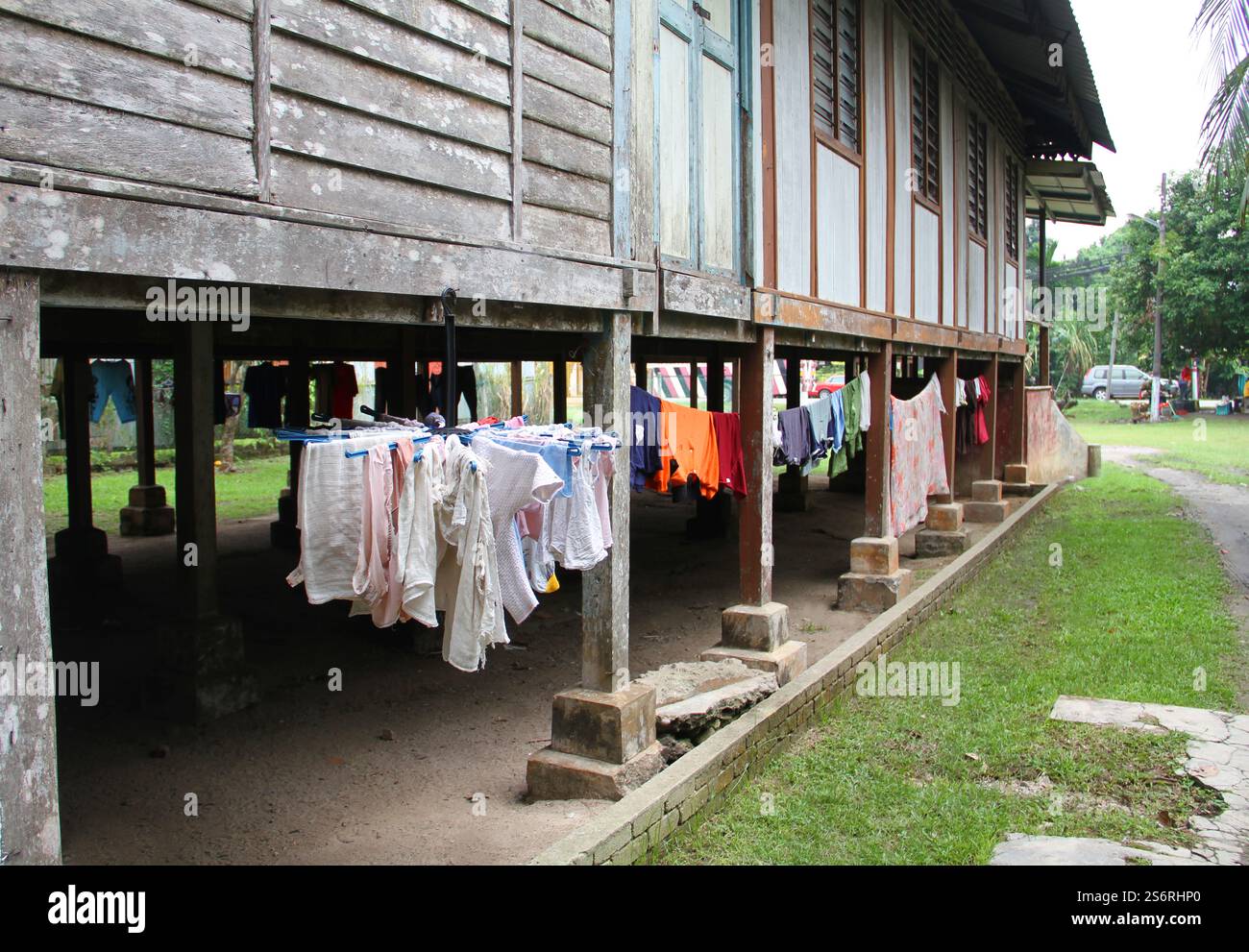 Old traditional Malay wooden house raised off the ground on wooden ...