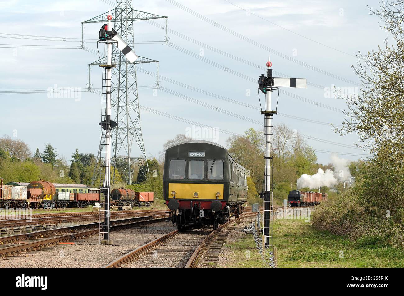 "47406" at Swithland Sidings, about to pass a class "101" D.M.U Stock ...
