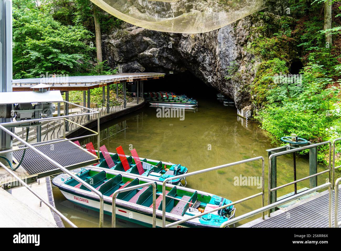 Tourists enjoy a tranquil boat ride in the striking Punkva Caves ...