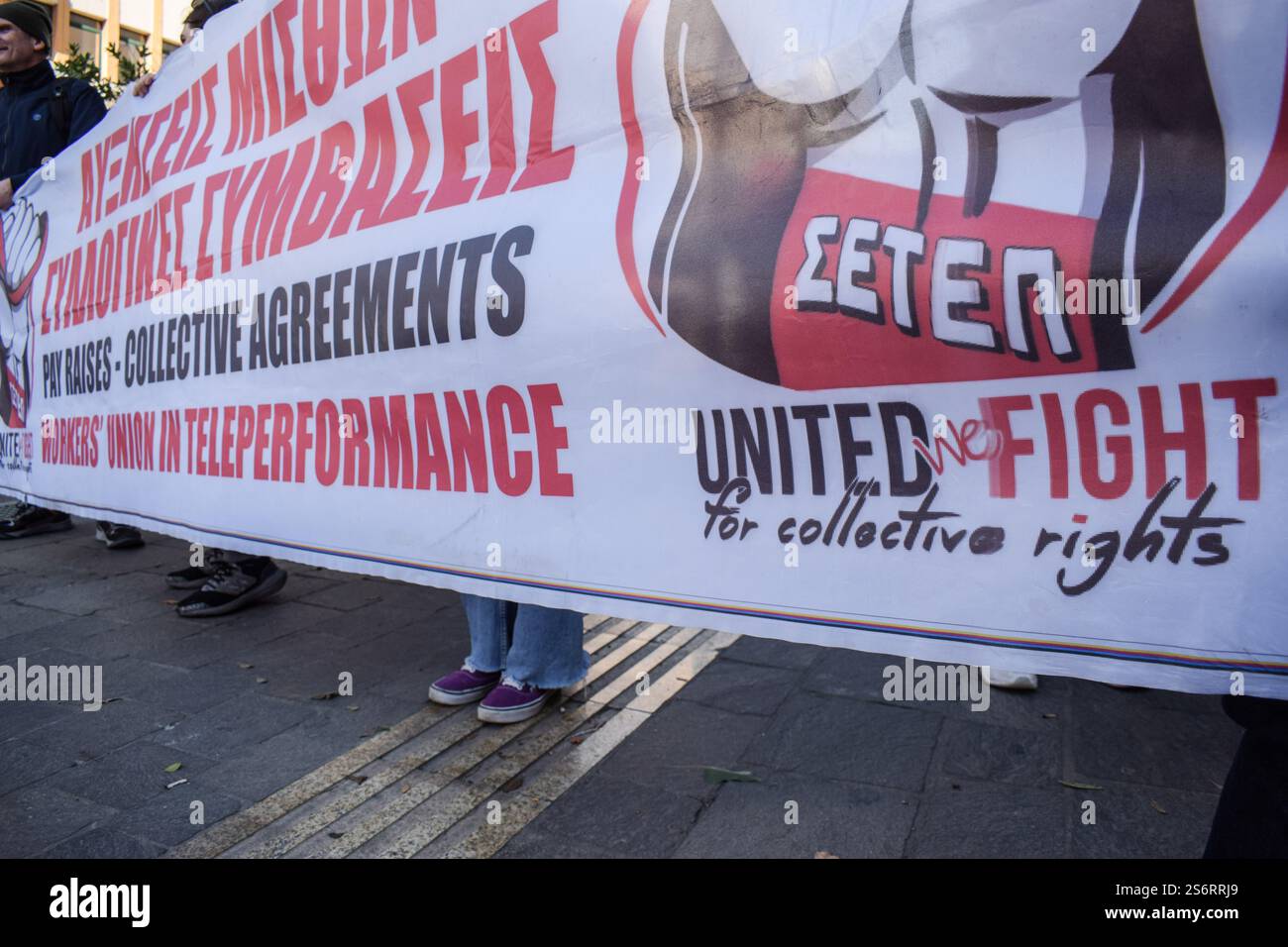 Piraeus, Greece. 17 January 2025. Protesters hold banner that reads ...