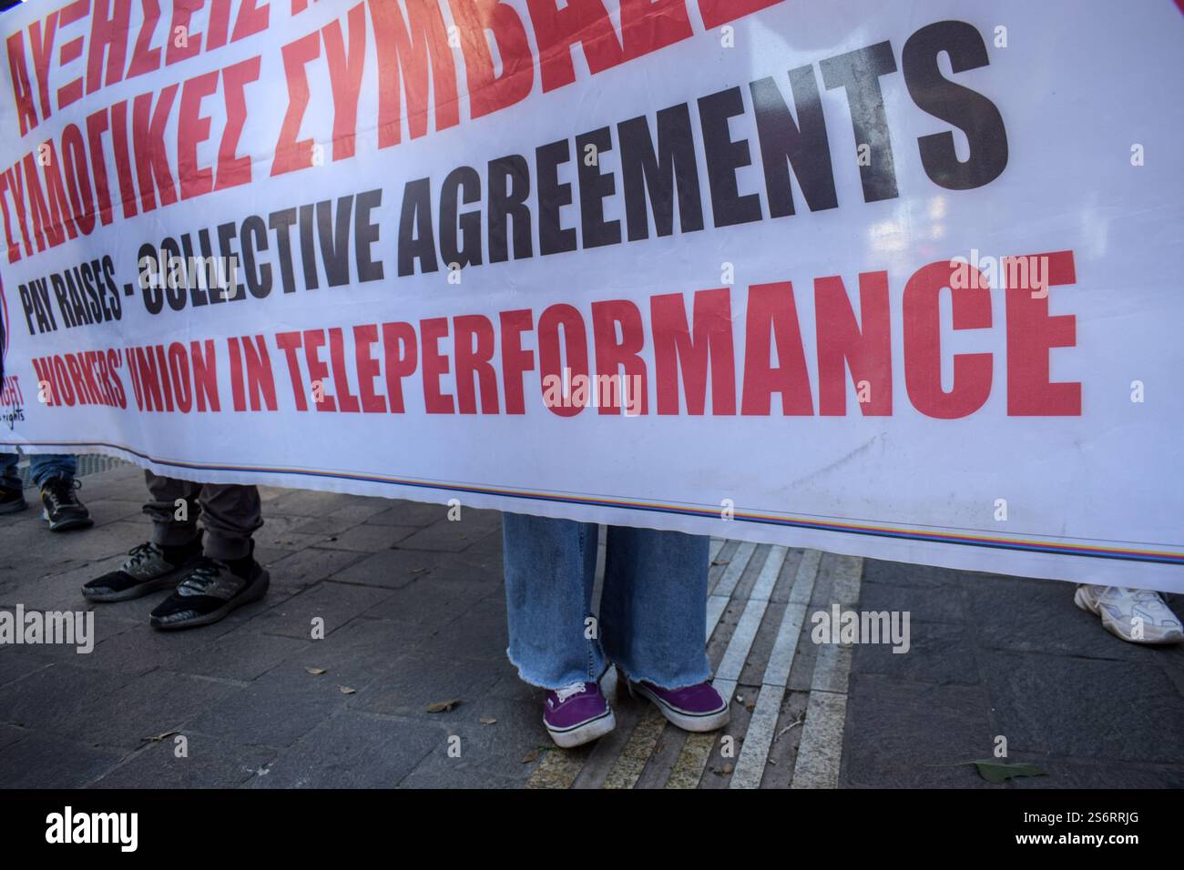 Piraeus, Greece. 17 January 2025. Protesters hold banner that reads ...
