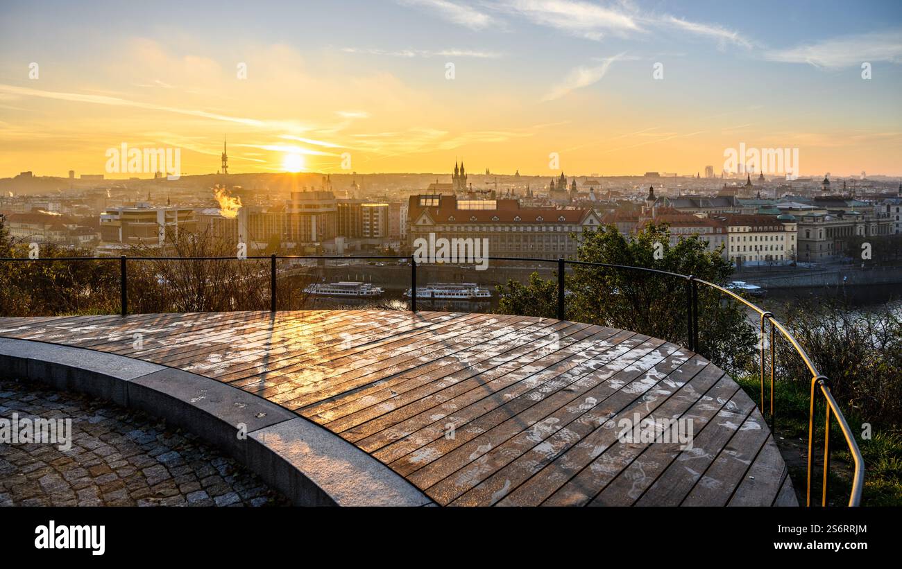 A serene view of Prague at sunrise from Letna Park showcases the city's ...