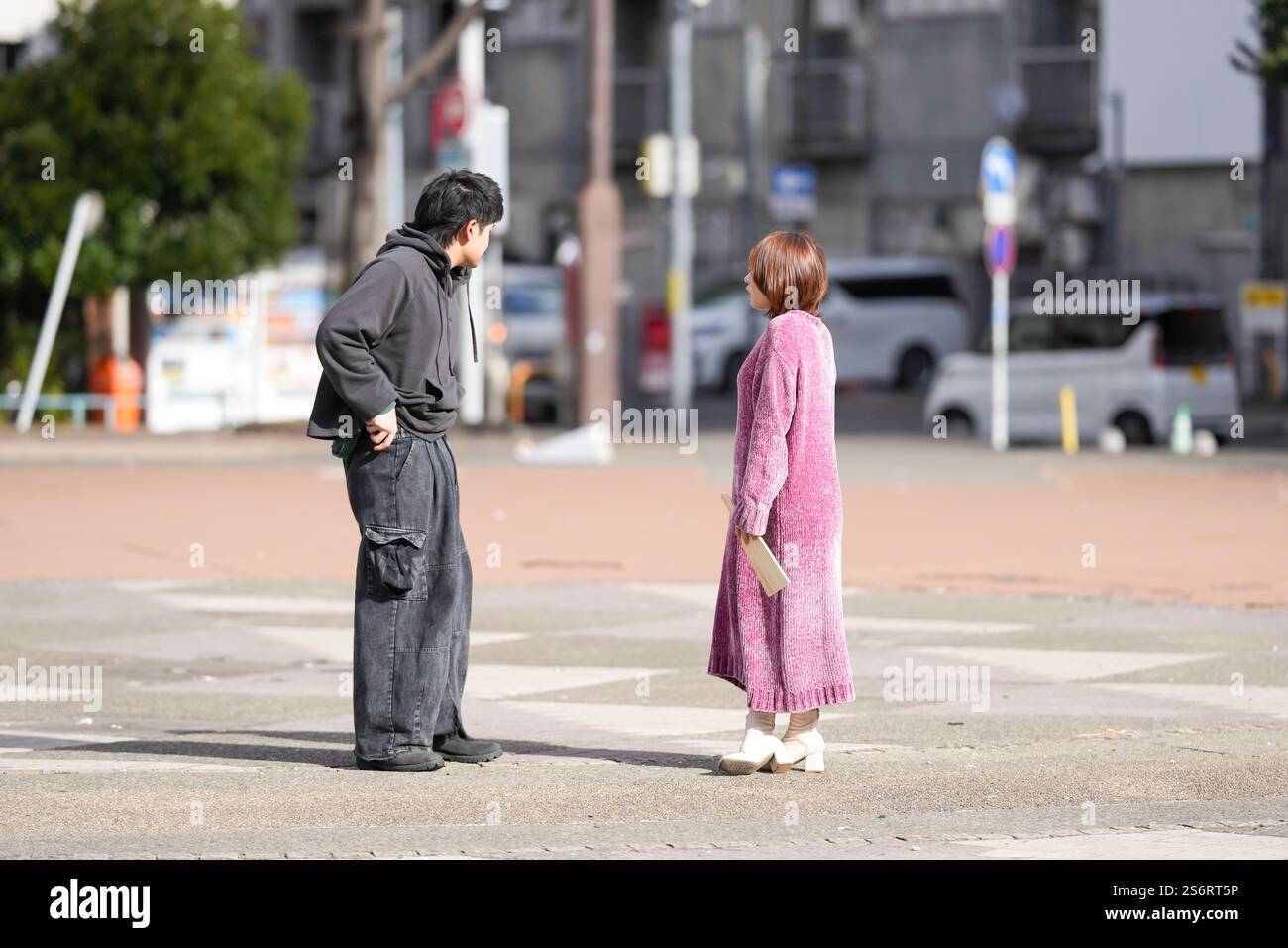 A Japanese man and woman in their 20s are playing hagoita, a ...