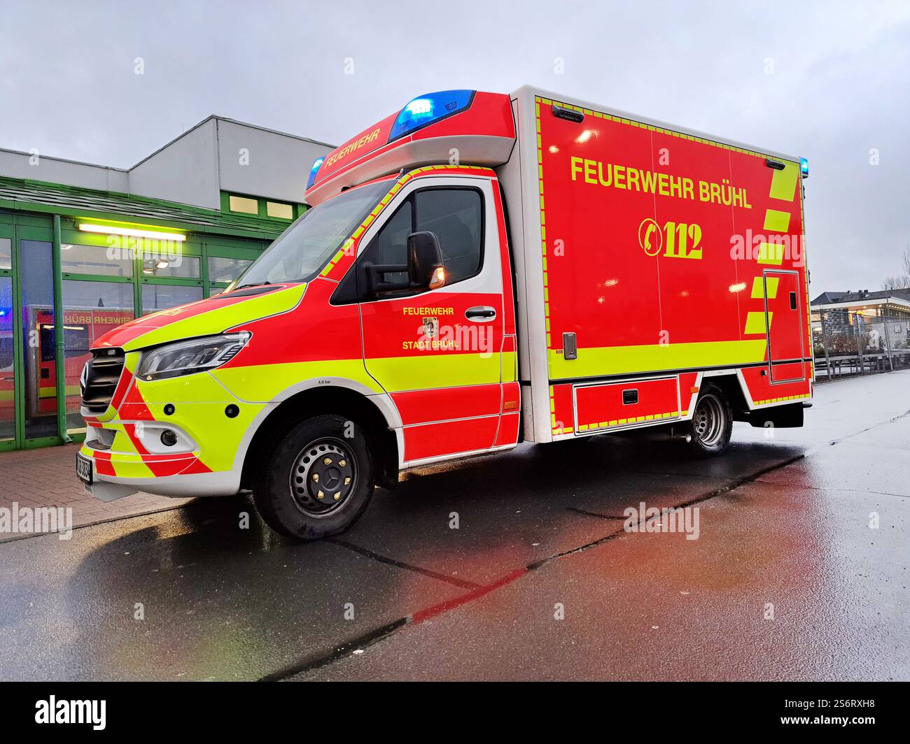 Fire department ambulance with flashing blue lights during an operation ...