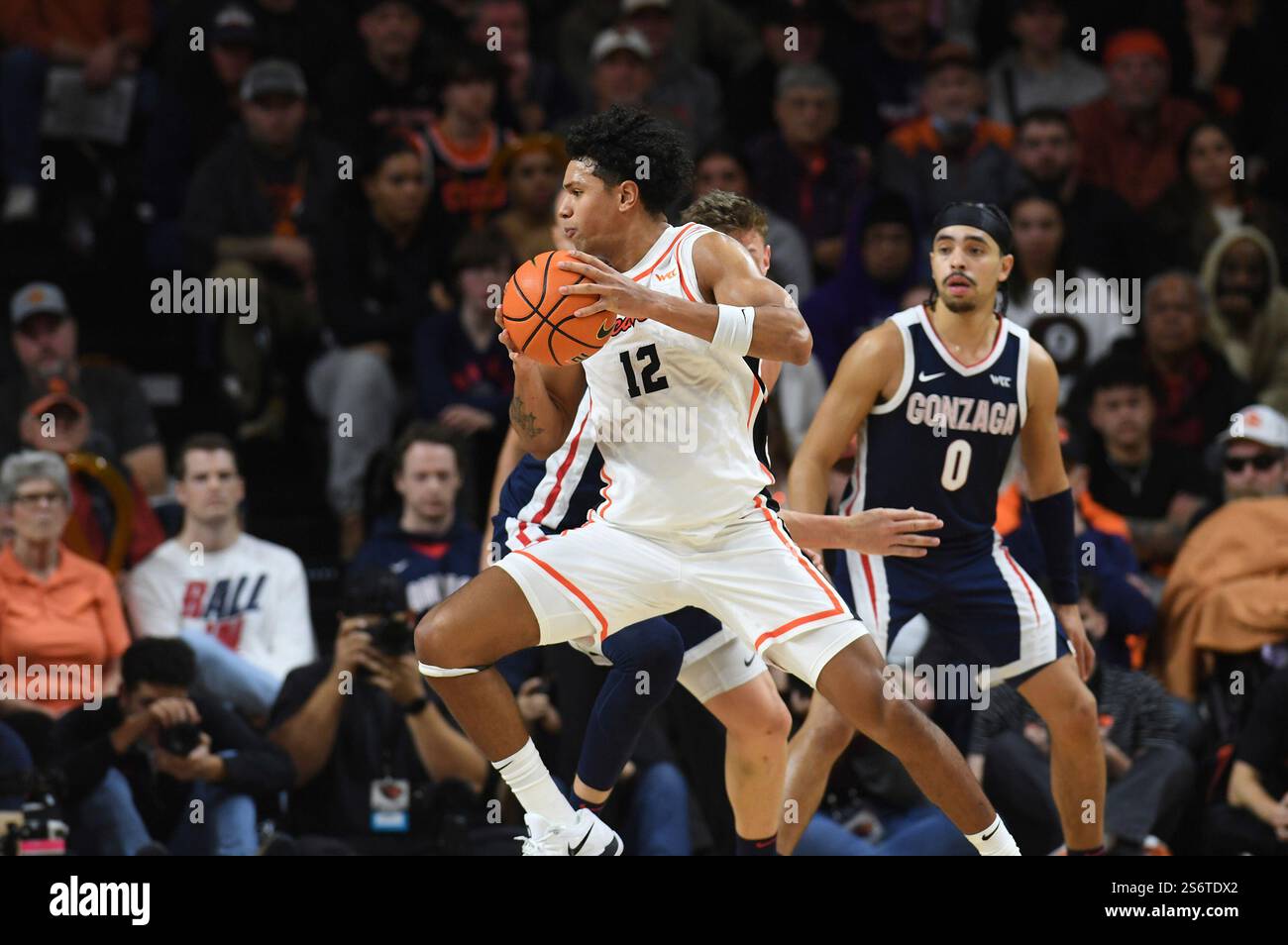 Oregon State forward Michael Rataj (12) drives around Gonzaga forward ...