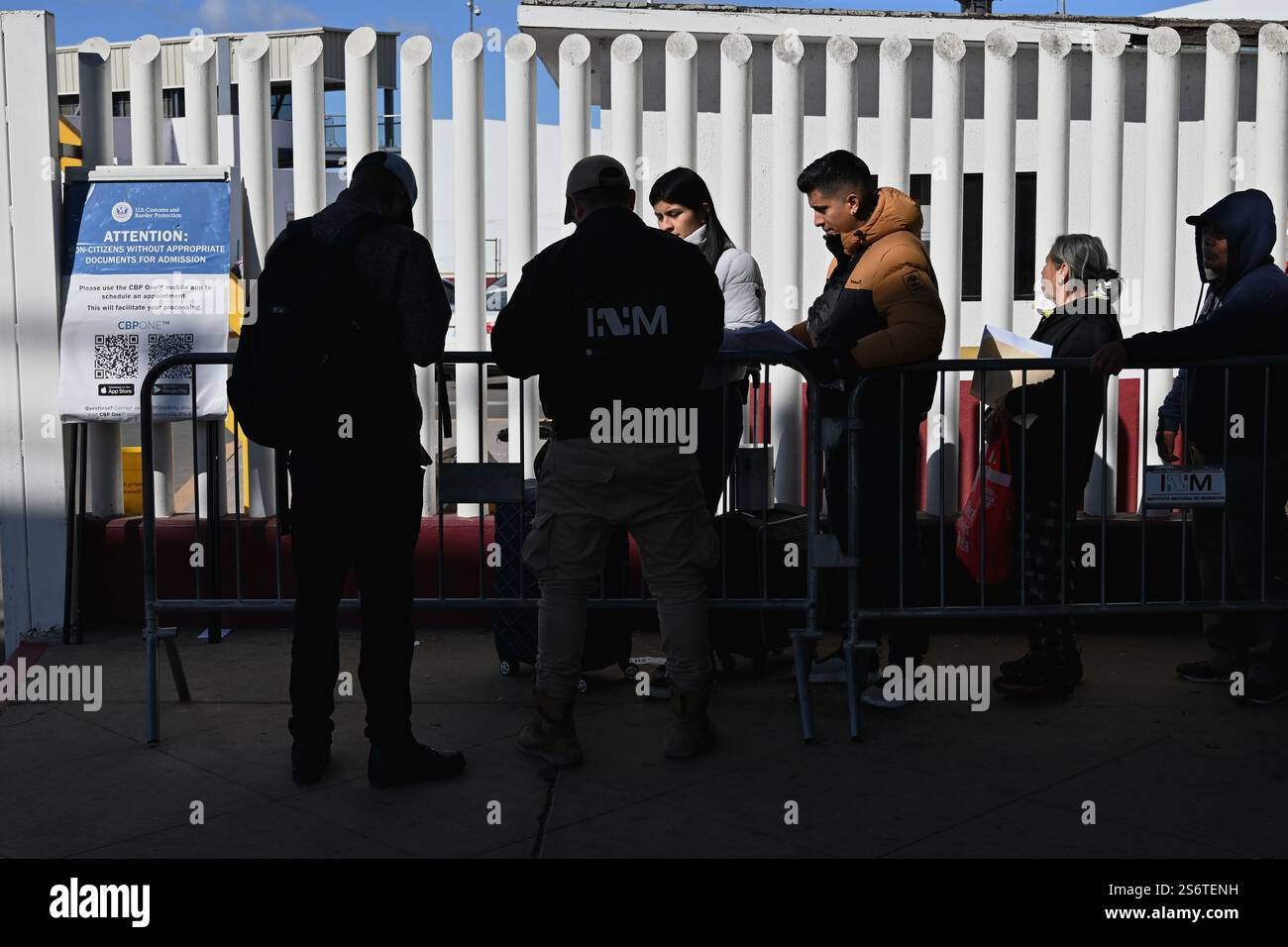 Asylum seekers prepare to enter the United States as a Mexican ...