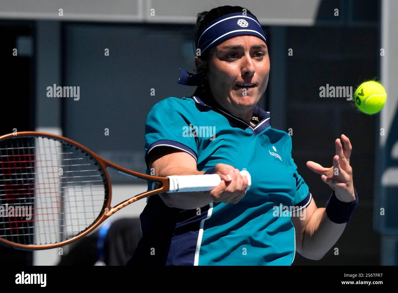 Ons Jabeur of Tunisia plays a forehand return to Emma Navarro of the U ...