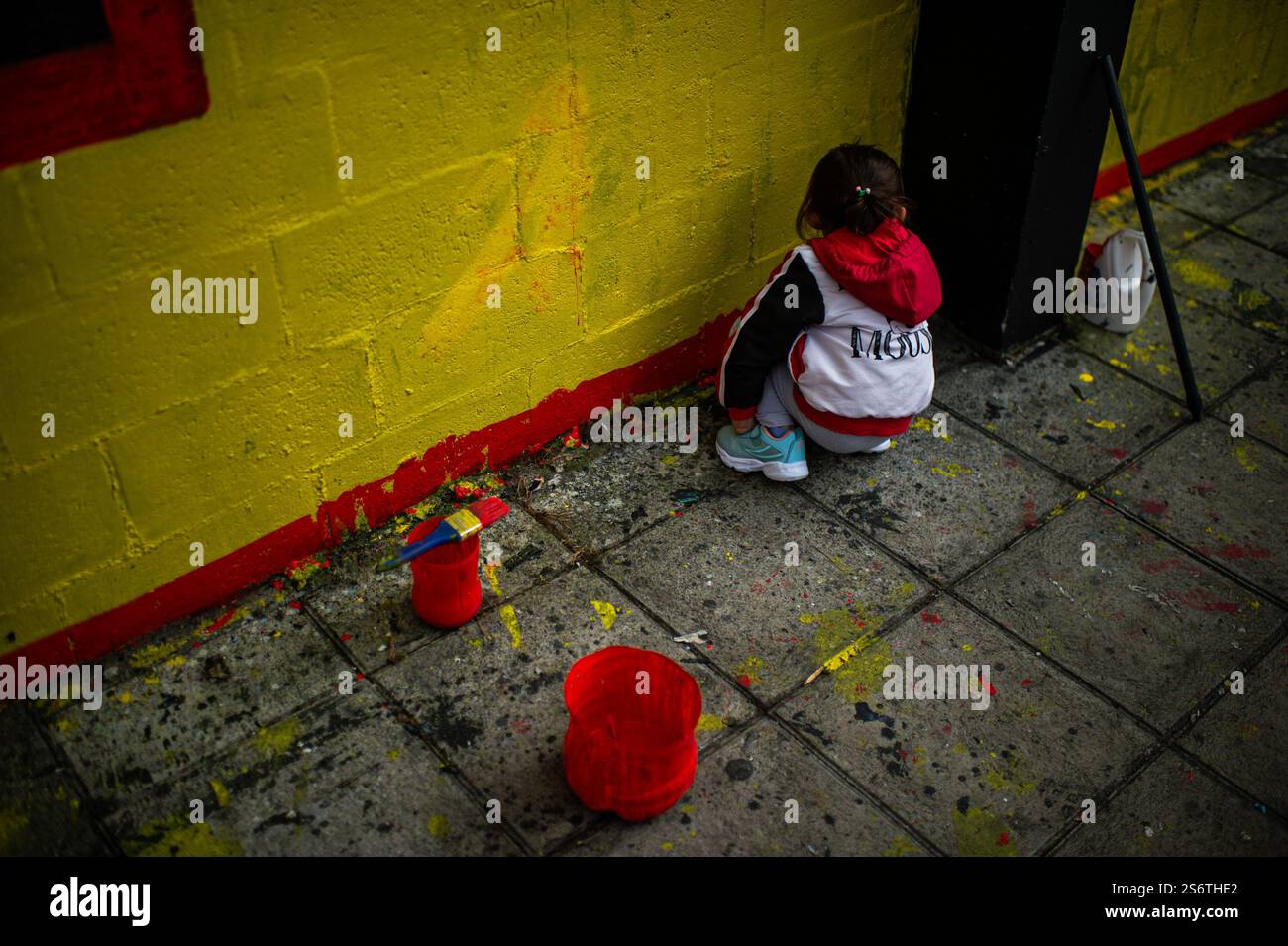 during a mural painting demonstration in honor of the people ...