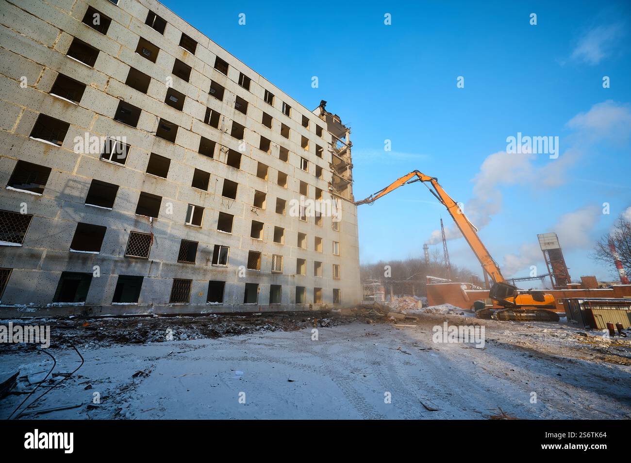 Building dismantling with high-altitude excavator destroyer Stock Photo ...