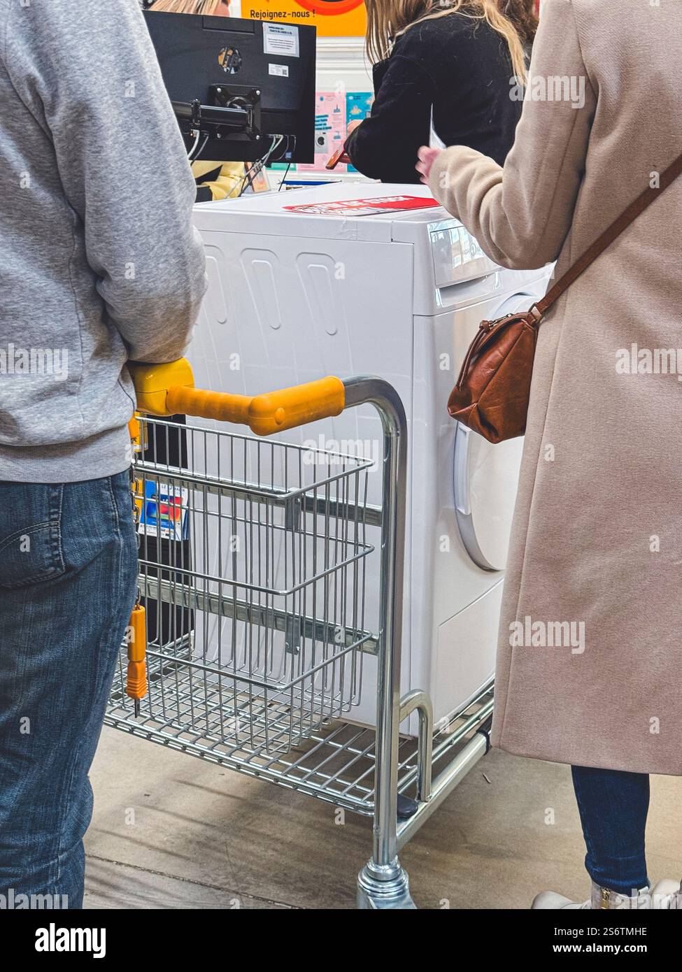Electro Depot store, couple with a washing machine at the checkout ...