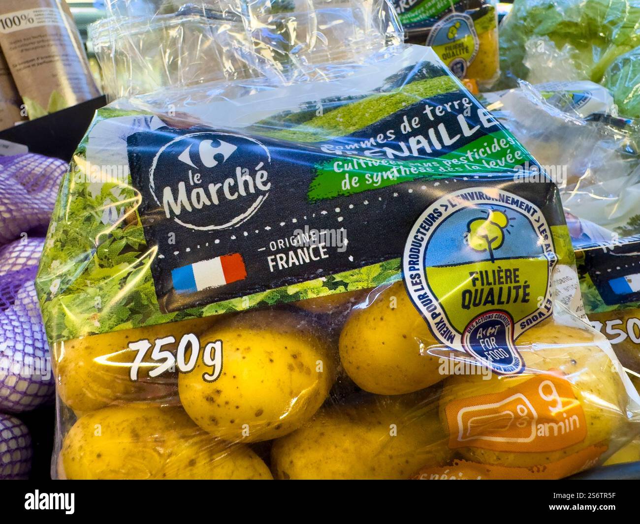 French potatoes, in plastic packaging with different labels Stock Photo ...