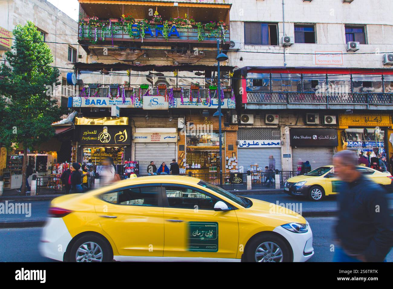 Jordan, Middle East, Amman. Yellow taxi in the Al Balad district Stock ...