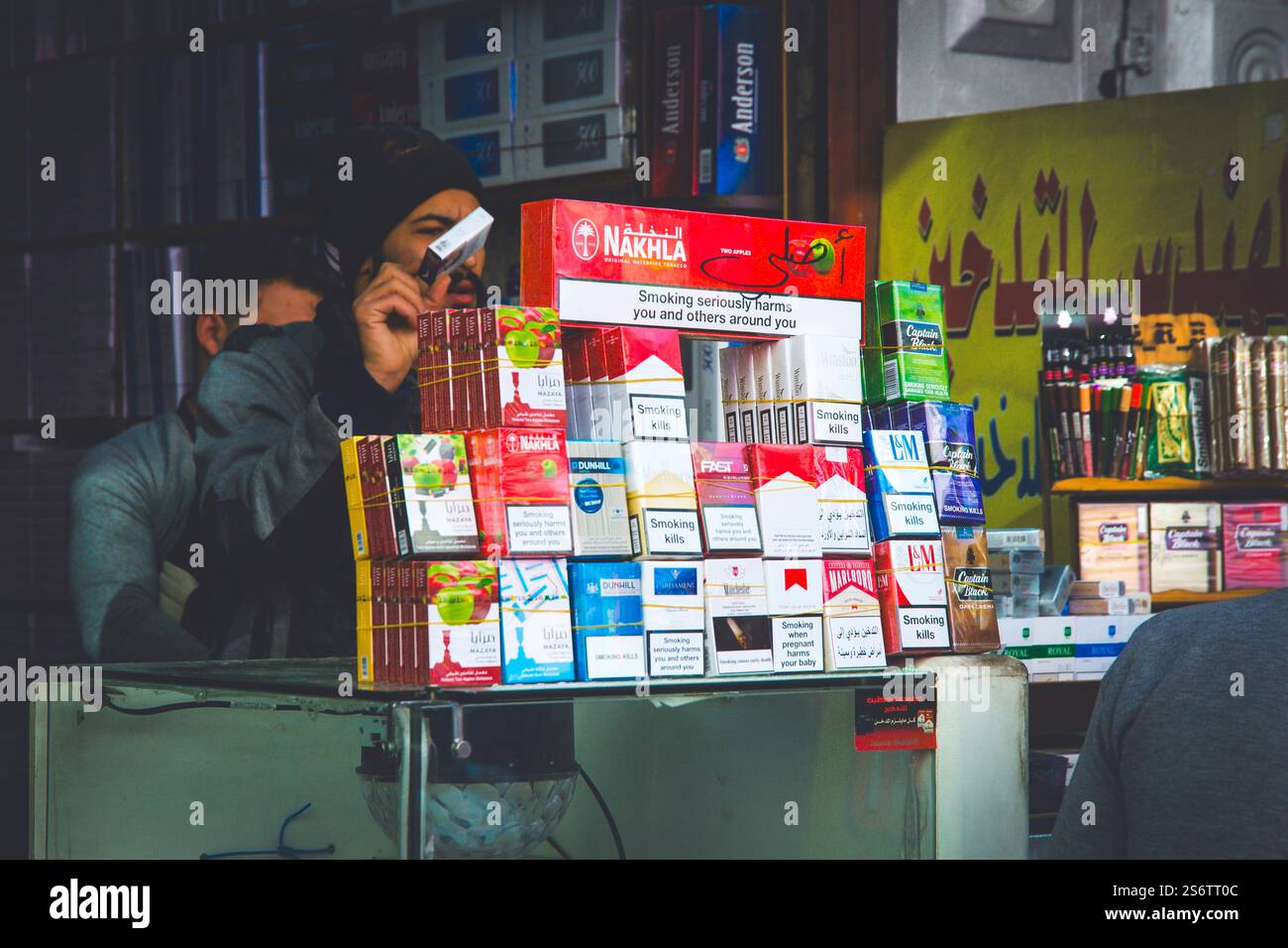 Jordan, Middle East, Amman. Al Balad district. Cigarette seller in the souk Stock Photo - Alamy